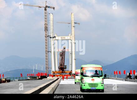 Chinese workers labor at the Pingtan Strait Road-rail Bridge, the world ...