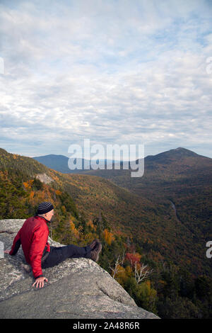Hiker Looking Down Steep Rock Wash On The Trail To Druid Arch in ...