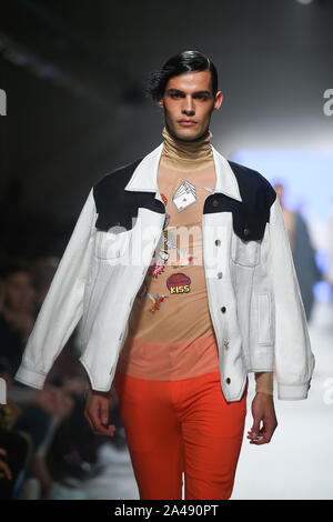 A model walks the runway during Dino Alves fashion show at ModaLisboa ...