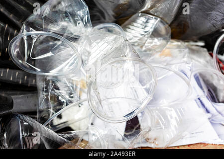 A pile of used paper cups in a trash bin Stock Photo - Alamy