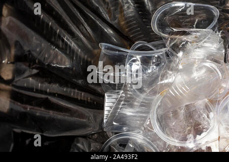 A pile of used paper cups in a trash bin Stock Photo - Alamy