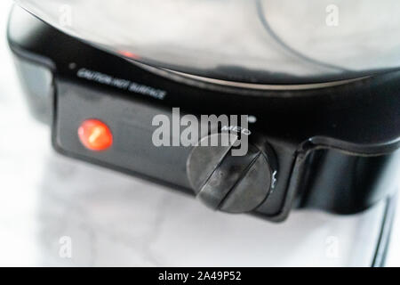 Melting chocolate melts in plastic bottles in hot water Stock Photo - Alamy