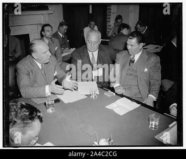 Former heavyweight champion Jack Dempsey poses with a photograph ...