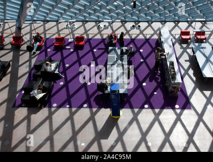 Interior view of Seattle Central Library with sloped glass roof ...