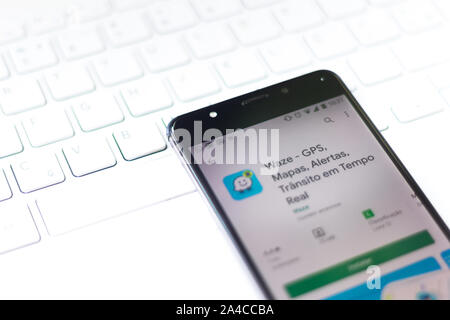 In this photo illustration, the Waze logo is displayed on a smartphone ...