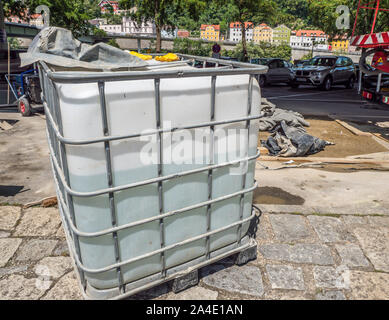 Plastic water tank at the construction site. Polyethylene container on ...