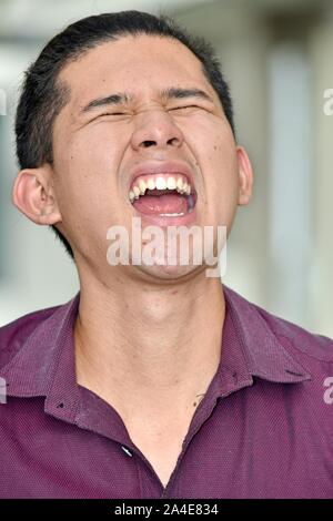 Handsome Filipino Male Laughing Stock Photo - Alamy