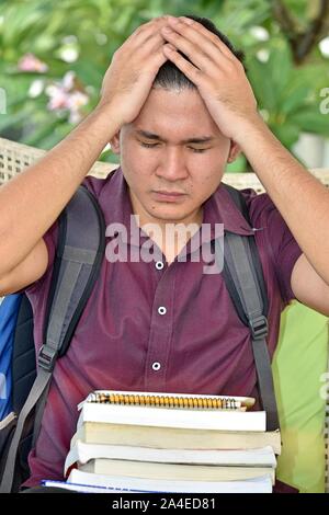 University Filipino Male Student And Worry With Books Stock Photo - Alamy