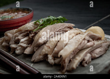 Asian food style marinated steamed chicken (Betong Chickken) and sauce ...