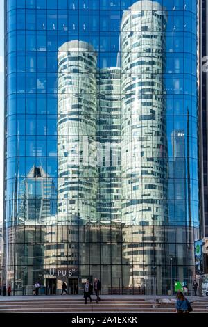 OPUS 12 GLASS BUILDING WITH THE REFLECTION OF THE COEUR DEFENSE TOWERS ...