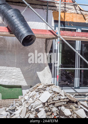 Debris chute construction site Stock Photo - Alamy
