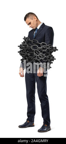 Businessman chained isolated on white Stock Photo - Alamy