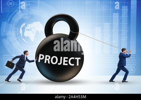 Businessman trying to deliver difficult project Stock Photo - Alamy
