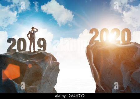 Businessman looking into the future 2020 from 2019 Stock Photo - Alamy
