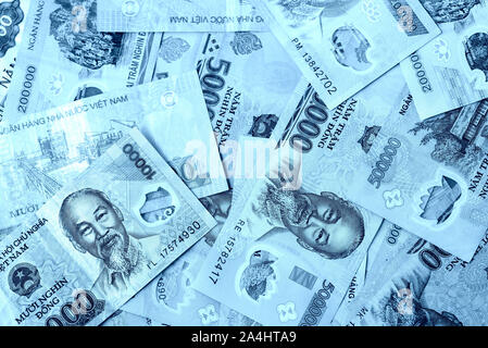 Vietnamese dong bills close up, blue color toned Stock Photo - Alamy