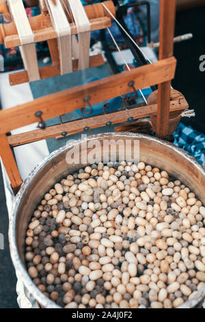 Silk Reeling Process by hand, Cocoon in the boiled water Stock Photo ...