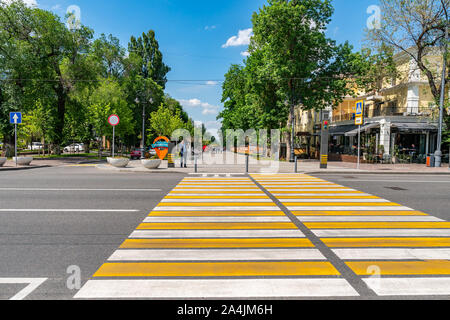 pedestrians walking on a crosswalk on sunny summer day Stock Photo - Alamy