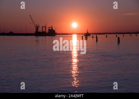 Beautiful sunset or sunrise over a salty lake, Wooden hemp in the build ...