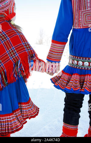 Laplander girl holding brothers hand. Lapp / Lapps / Laplander ...