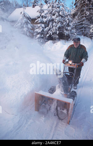 Man using snow blower/snowblower Stock Photo - Alamy