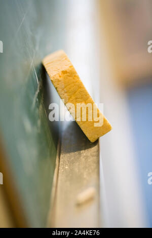 Blackboard sponge and chalks Stock Photo - Alamy