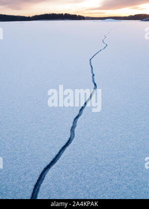 cracking ice on the lake Stock Photo - Alamy