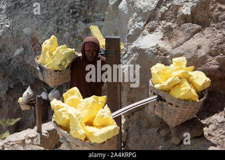 Heavy basket laden by pieces of natural sulfur to carry by miners from ...