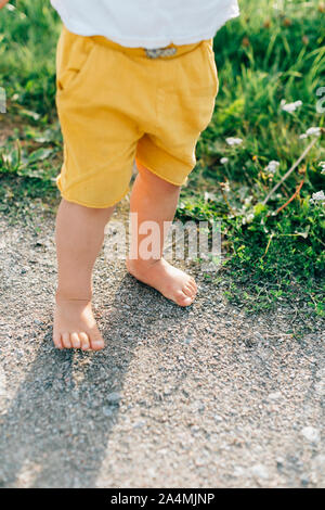 Low angle view of child's legs climbing up jungle gym Stock Photo - Alamy