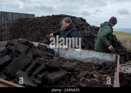 Crofters at Totegan on Strathy Point in Caithness Scotland stack peat ...