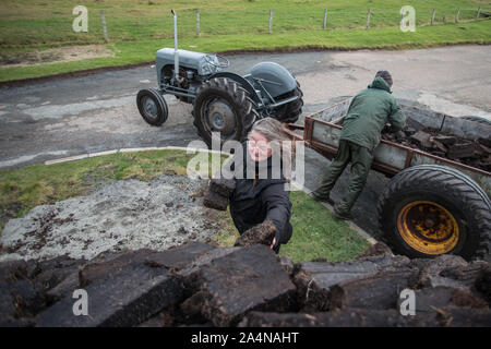 Crofters at Totegan on Strathy Point in Caithness Scotland stack peat ...