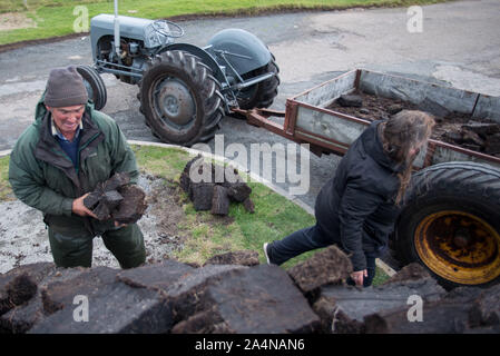 Crofters at Totegan on Strathy Point in Caithness Scotland stack peat ...
