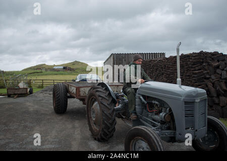 Crofters at Totegan on Strathy Point in Caithness Scotland stack peat ...