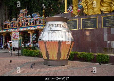 Decorated Hindu statue of Lord Murugan on top of a kadavi carried by a ...