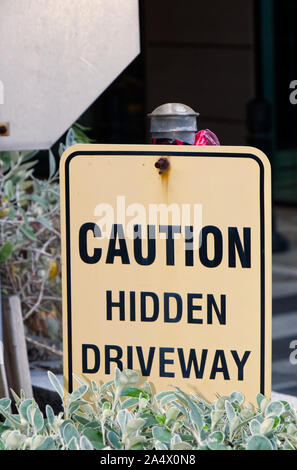 A hidden driveway road sign Stock Photo - Alamy