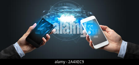 Two mobile phones syncing through the cloud Stock Photo - Alamy