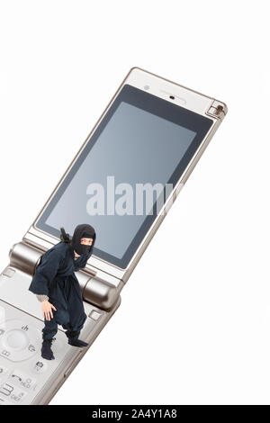 Ninja and mobile phone screen Stock Photo - Alamy