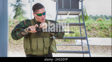 Military experience - Handsome commando shooting with a Kalashnikov ...
