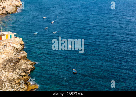 Aerial view of fishing cabin and boat on peaceful lake Stock Photo - Alamy