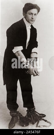 Magician and illusionist Harry Houdini in chains and handcuffs Stock ...