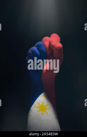 Raised fist of a Philippine flag. Filipino hand showing a symbol of ...