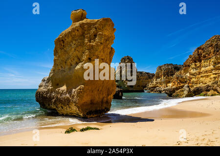 Golden sandstone cliffs overlooking the Praia da Marinha (Marinha Beach ...