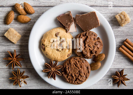 Tasty cookies with chocolate crumbles, anise stars spices, brown sugar ...
