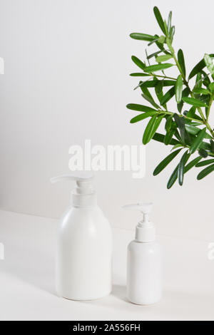 Bottles of shampoo on color background Stock Photo - Alamy