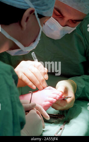 surgeons in sterile gloves perform surgery Stock Photo - Alamy