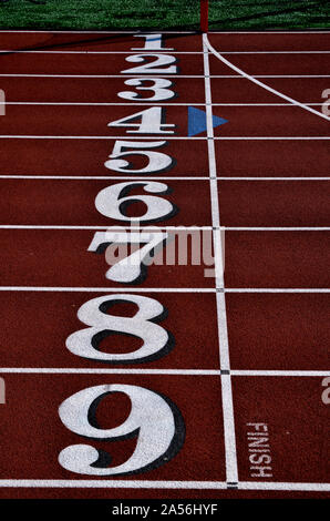 Track and field surface with numbers and orange color Stock Photo - Alamy