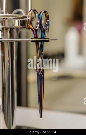 Professional hairdressing scissors on the stand, in barber shop Stock ...