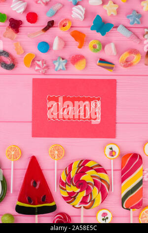 Sweets creative lay out, dessert concept with lollipops, jellies, candy ...