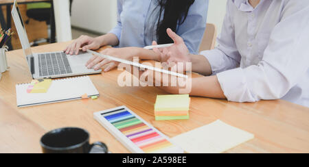 Cropped shot of young man planing his project on computer pc with white ...