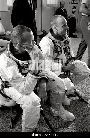 U.S. astronauts L. Gordon Cooper Jr. and Charles Conrad Jr. walk across ...