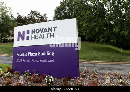 A logo sign outside of the headquarters of Novant Health in Winston ...